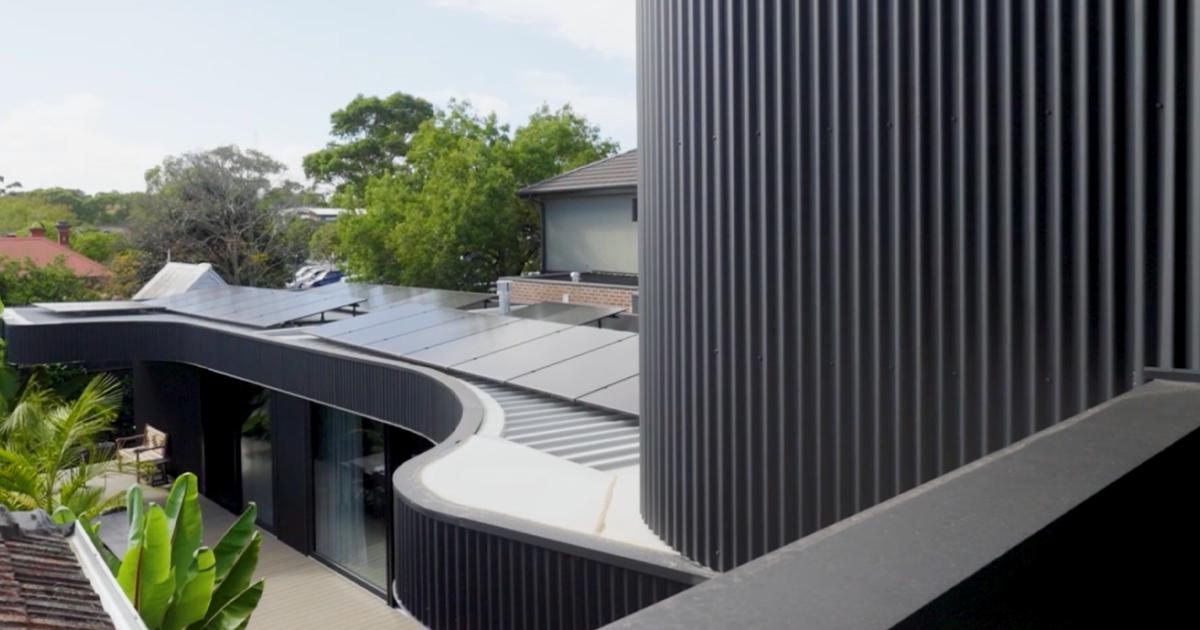 Ripple House: Modern Design with CUSTOM ORB® Cladding